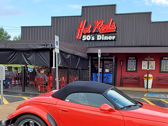 Hot Rods' bold red-and-black facade with that classic neon sign sets the stage for a meal that's part food, part time travel.