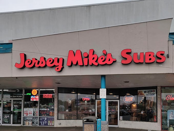 Jersey Mike's clean, bright storefront stands ready for the lunch rush. That red sign is like a bullseye for sandwich hunters.