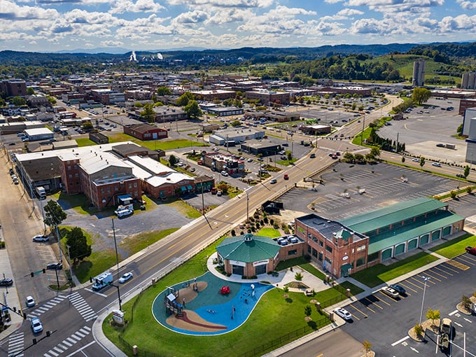 Kingsport's aerial view showcases its affordable small-town charm with community amenities like a splash pad and ample parking for residents.