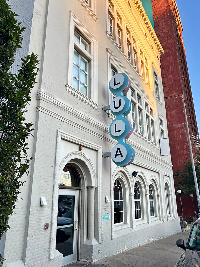 The elegant white facade and blue "LULA" sign promise Southern sophistication that carries through from the architecture to the perfectly fried chicken.