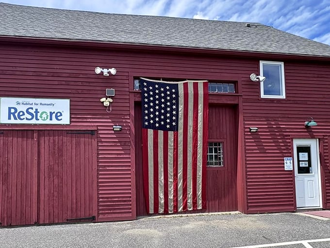 A barn-red ReStore with an American flag so large it could double as a parachute – pure Maine character with bargains to match.