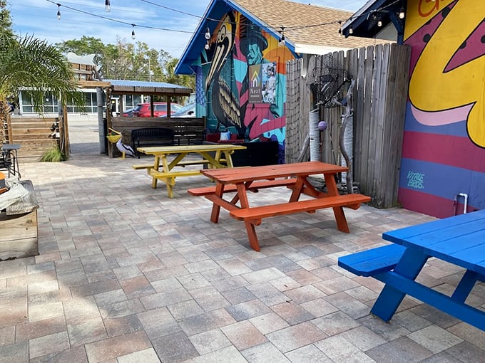 Mullet's Fish Camp's colorful picnic tables invite you to forget adulting and focus on what matters: incredible seafood.