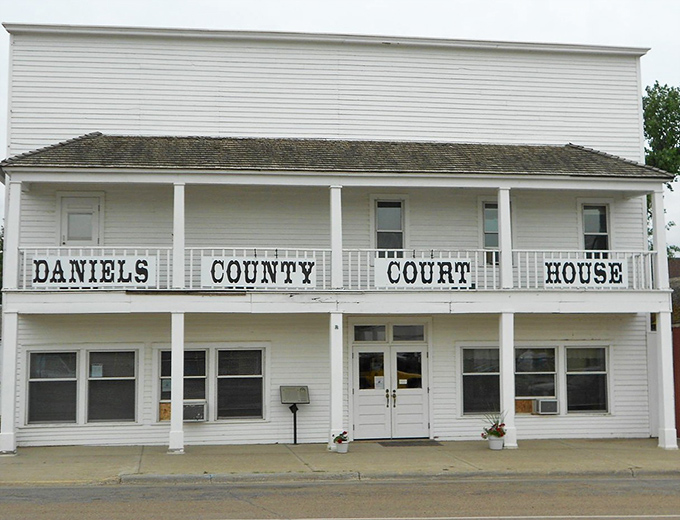 The Daniels County Courthouse stands proud in Scobey, where government is small and so are your property tax bills.
