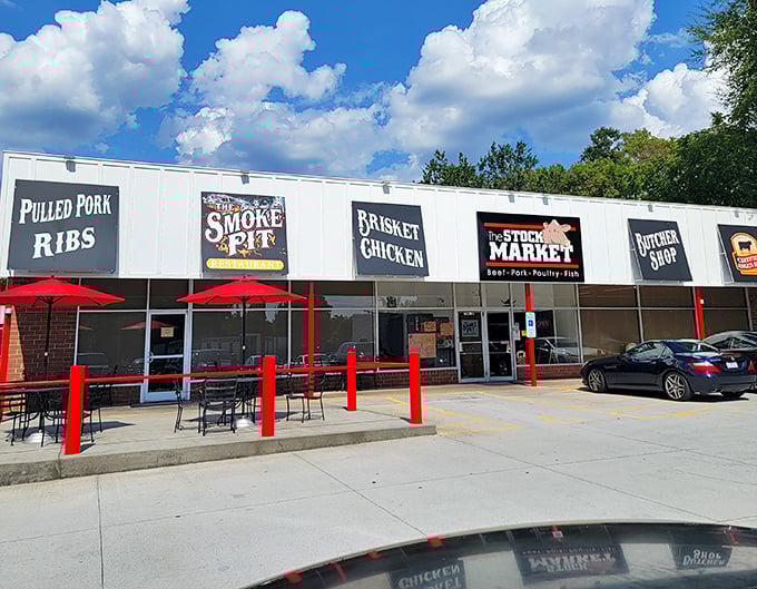 The Smoke Pit's straightforward signage tells you exactly what you're in for&mdash;pulled pork, ribs, and brisket that mean serious business.