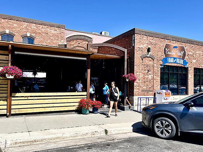 The Custer Wolf's brick facade and wooden patio create the perfect backdrop for burger-induced happiness.