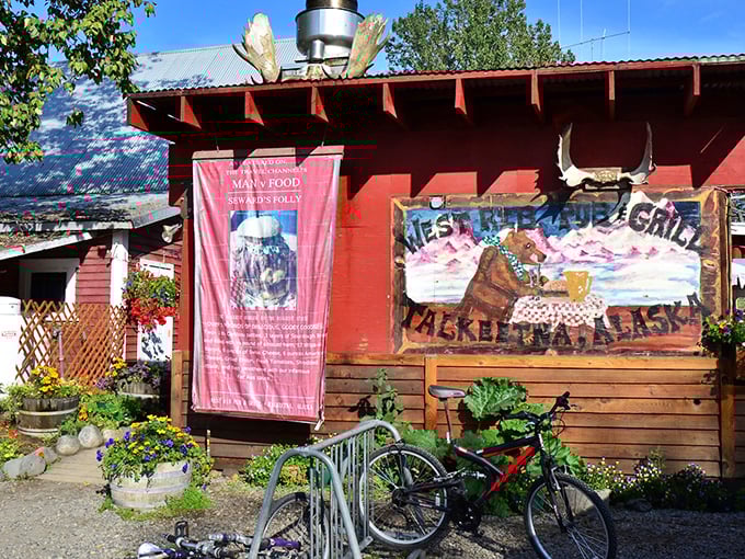 That hand-painted sign and rustic wood exterior capture Talkeetna's adventurous spirit perfectly before you even step inside.