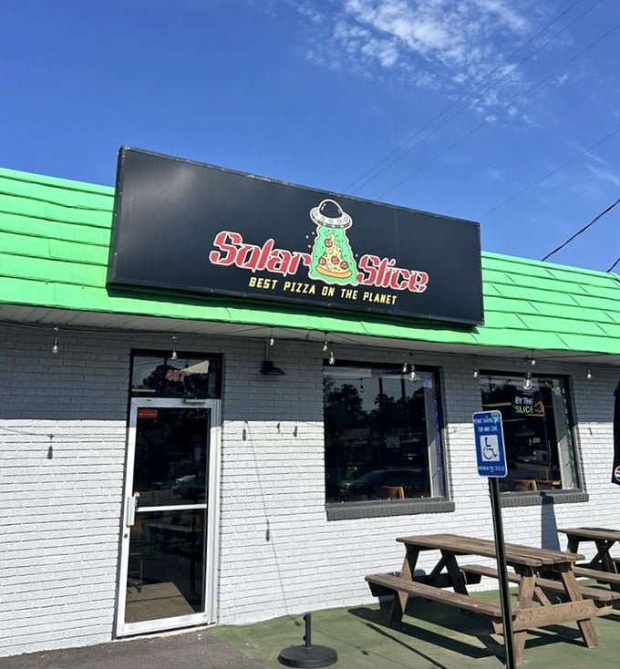 Solar Slice's playful sign promises "the best pizza on the planet" &ndash; a cosmic claim backed by down-to-earth deliciousness in a lime-green package.
