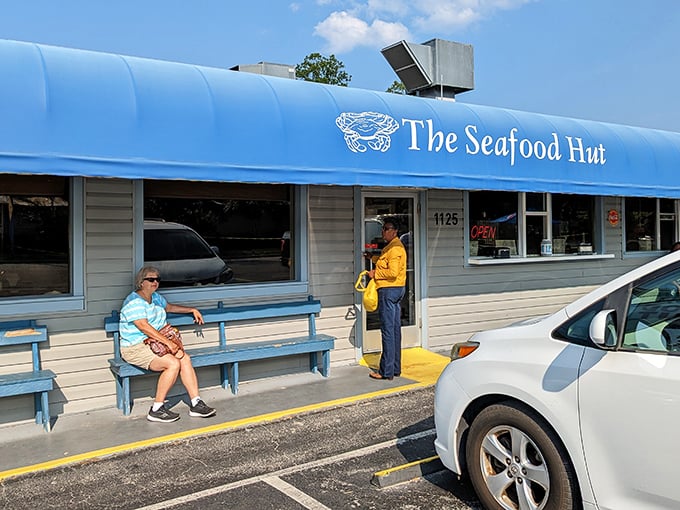 Behind that blue awning lies a world where "Calabash-style" isn't just a cooking method &ndash; it's practically a religion with devoted followers.