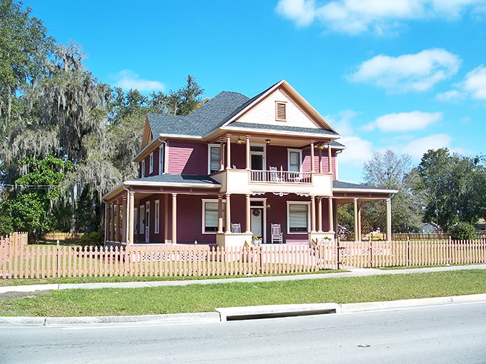 This pink Victorian beauty in Fort Meade isn't just a house—it's a time machine to when porches were for sitting and neighbors actually visited.