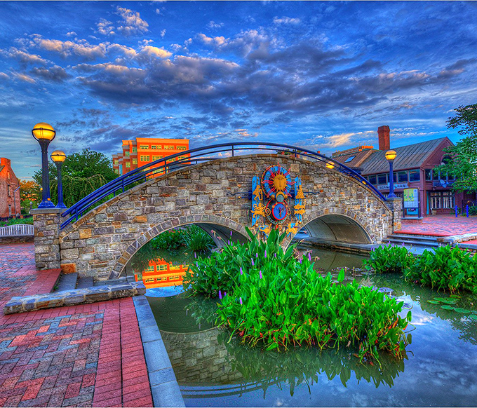 Frederick's Carroll Creek Park bridge - where stone, water, and art create a magical urban oasis that glows at twilight.