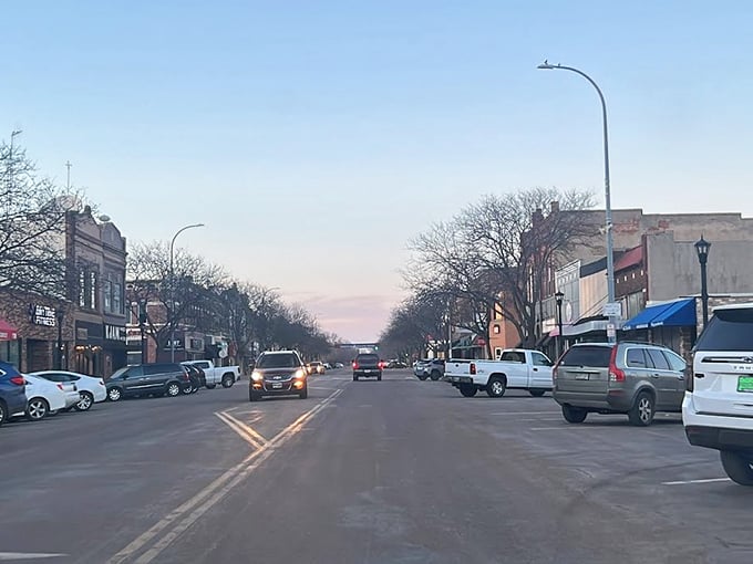 Evening settles over downtown streets where the pace stays slow and neighbors still stop to chat.