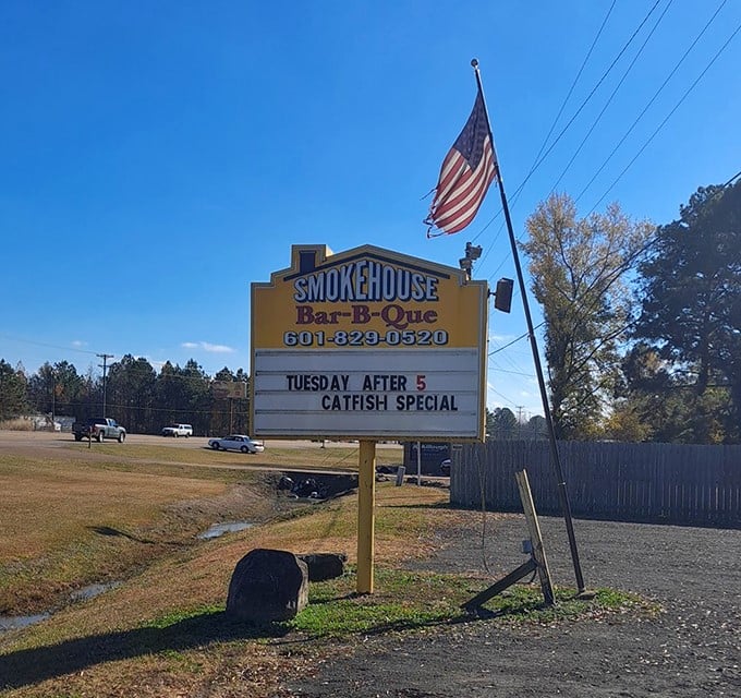 That simple yellow sign and American flag promise two things: patriotism and perfect brisket await inside.