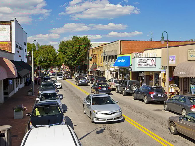 Waynesville's charming Main Street buzzes with activity under perfect blue skies, inviting visitors to explore local shops and eateries.