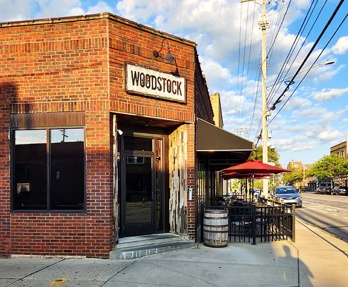The simple "WOODSTOCK" sign promises peace, love, and perfectly smoked meats in equal measure.