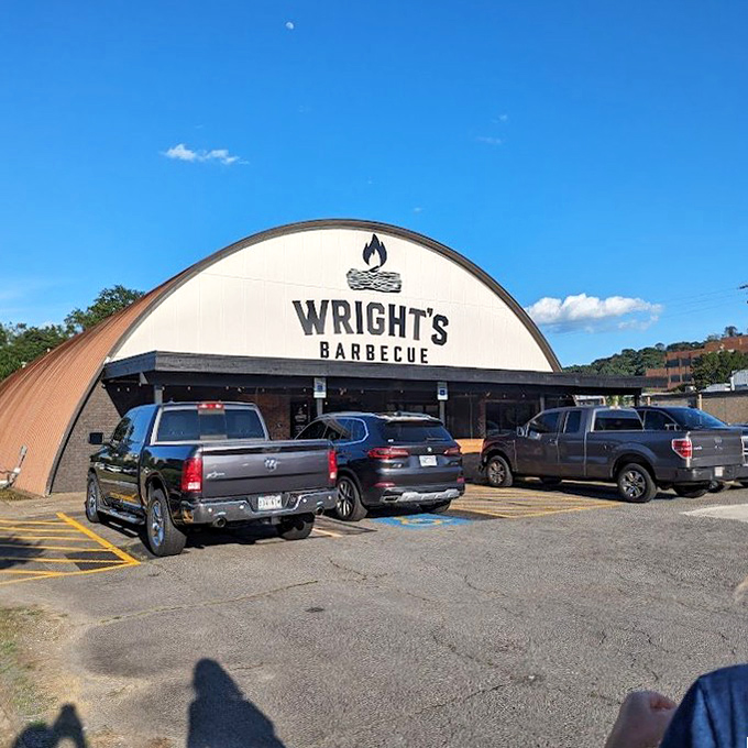 BBQ barn meets meat paradise! Wright's unique building stands out like a beacon to hungry travelers seeking authentic Arkansas smoke mastery.