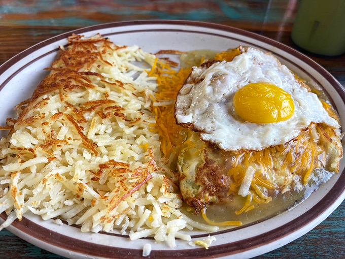 When breakfast meets the Southwest, magic happens. This cheese-blanketed creation topped with a sunny-side-up egg is what morning dreams are made of.