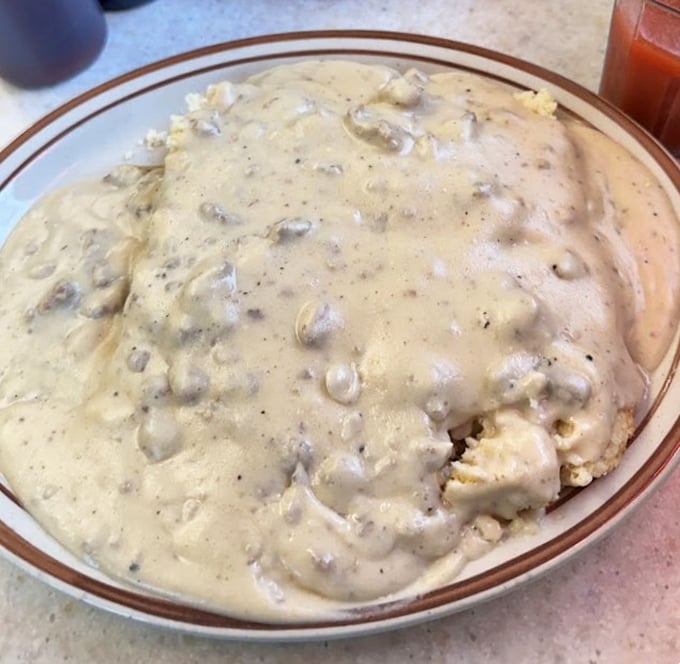 Biscuits and gravy that would make your Southern grandmother nod in approval &ndash; a creamy, peppery blanket covering fluffy clouds of dough.