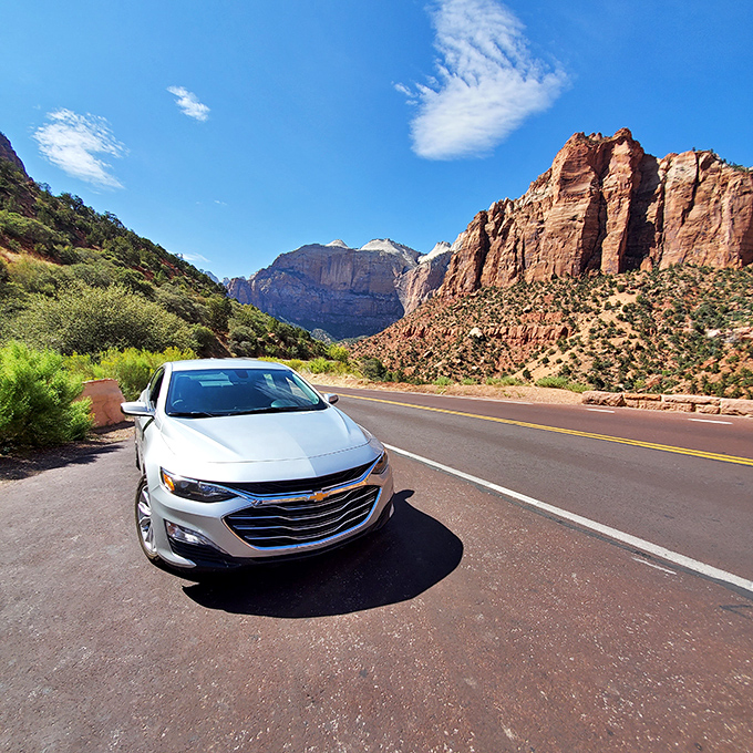 Road trip perfection captured in a single frame. Your car becomes the smallest character in nature's grandest production.