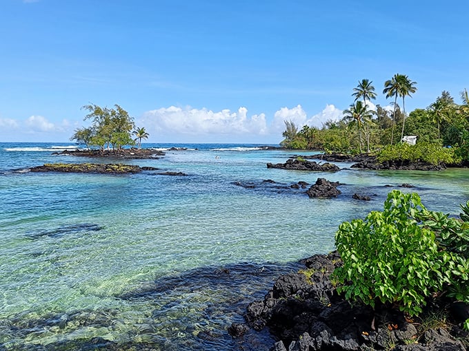 Turquoise waters meet volcanic rock in a scene so perfectly Hawaiian it could be the desktop background on your computer right now.