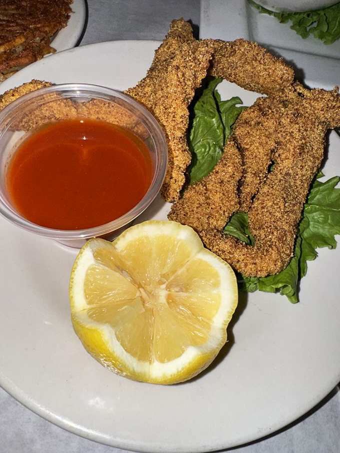 Crispy, golden catfish that makes you wonder why you ever order anything else. That sauce isn't optional&mdash;it's mandatory deliciousness.