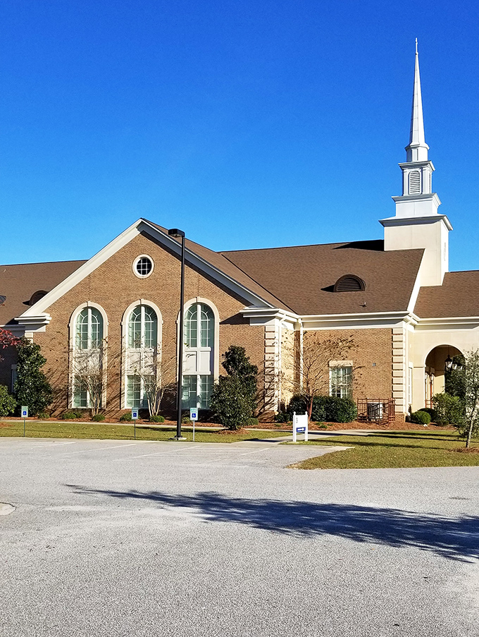 This stately church with its soaring steeple serves as both spiritual anchor and architectural gem in Darlington's community landscape.