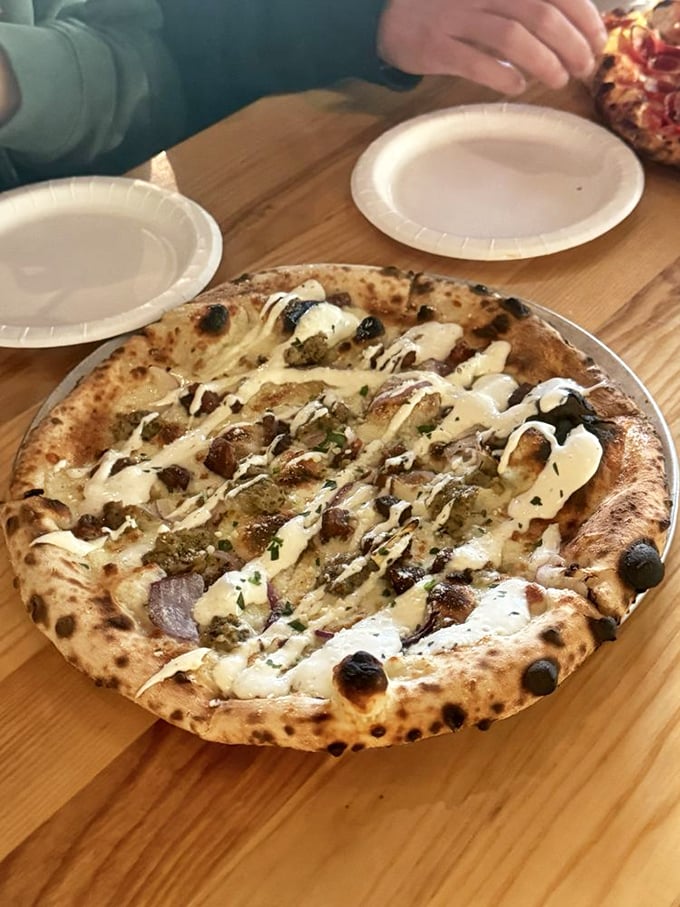 Not just a pizza with toppings, but a carefully composed flavor symphony where each ingredient plays its part in perfect harmony.