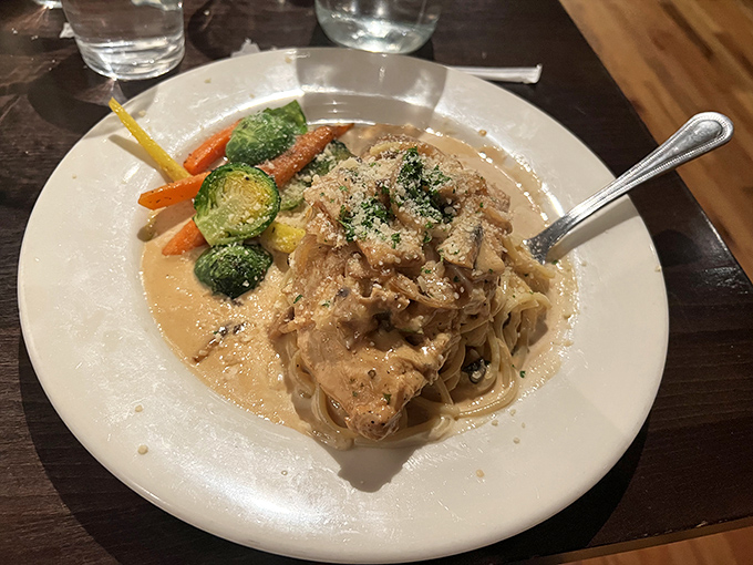 A plate that whispers "date night" with tender chicken, velvety sauce, and vegetables that actually make you want to eat your greens.