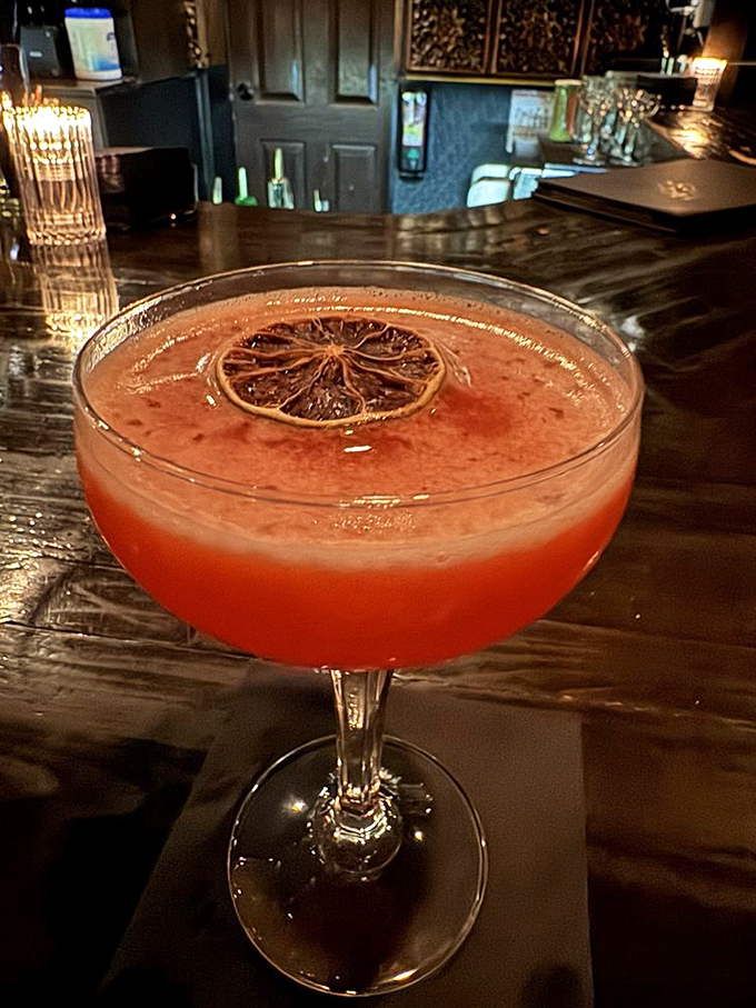 This isn't just a cocktail—it's liquid history in a coupe glass, garnished with a dehydrated citrus wheel that's both functional and fashionable.