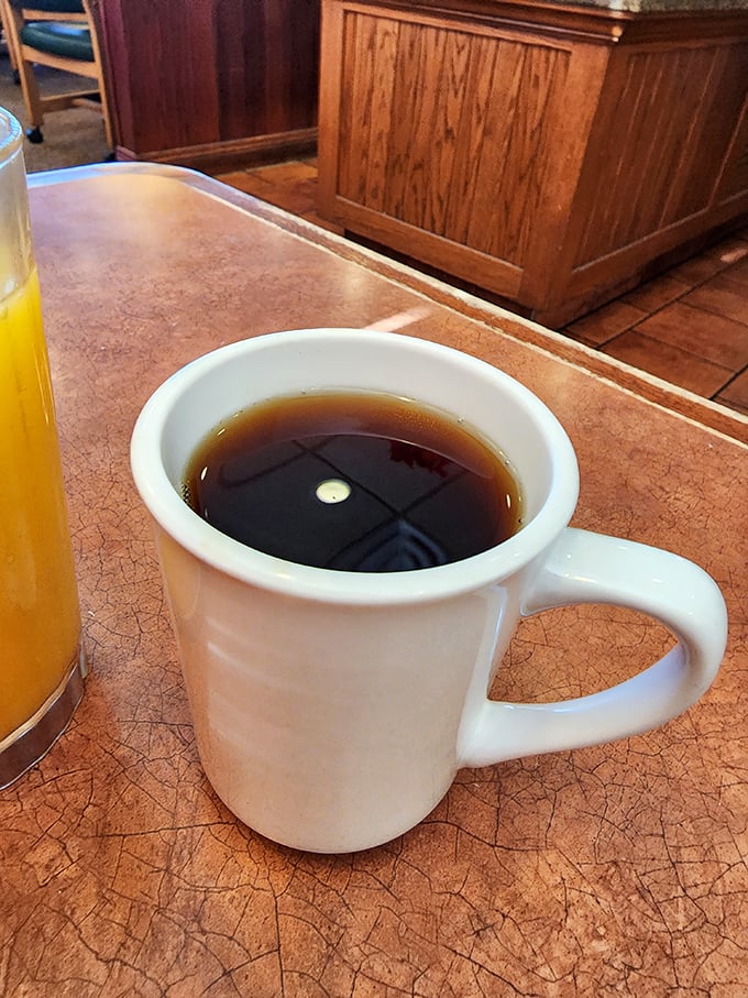 The unsung hero of every great breakfast—a sturdy mug of coffee that promises to transform you from zombie to human with each sip.