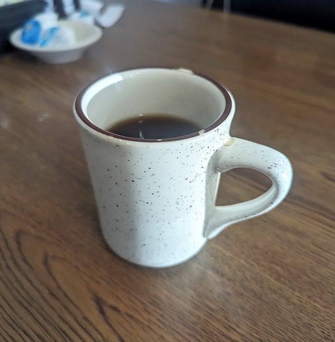 That classic diner coffee mug&mdash;sturdy, speckled, and filled with brew that keeps conversations flowing and road trips moving.