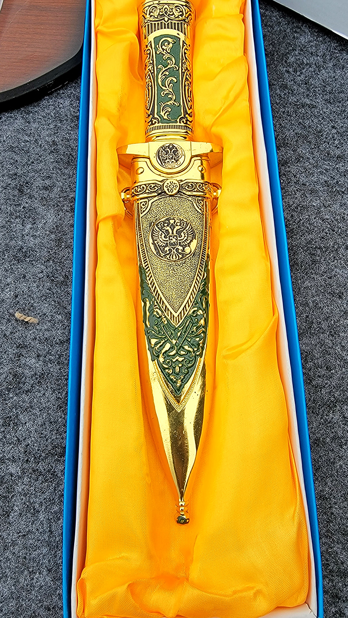 Ornate craftsmanship gleams in its velvet nest. This ceremonial dagger represents the unexpected treasures that make flea markets the ultimate adventure for collectors.