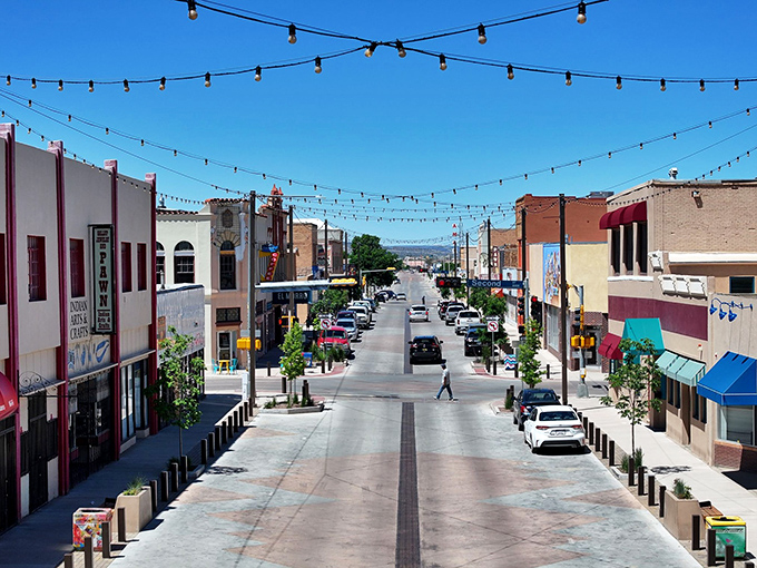 String lights crisscross above Gallup's main thoroughfare, transforming ordinary evenings into something magical without breaking the retirement budget.