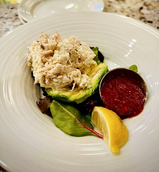 Dungeness crab perched on avocado like it's the throne it deserves. The ocean and garden collaborated on this masterpiece.