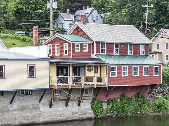 Riverside homes perch above the water like colorful birds ready to dip their toes in, creating living spaces that blur the line between architecture and nature.