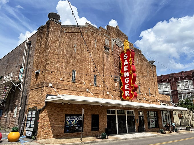 The Saenger's vintage marquee glows with promise. This isn't just a theater&mdash;it's a time machine with better popcorn than they had in the old days.