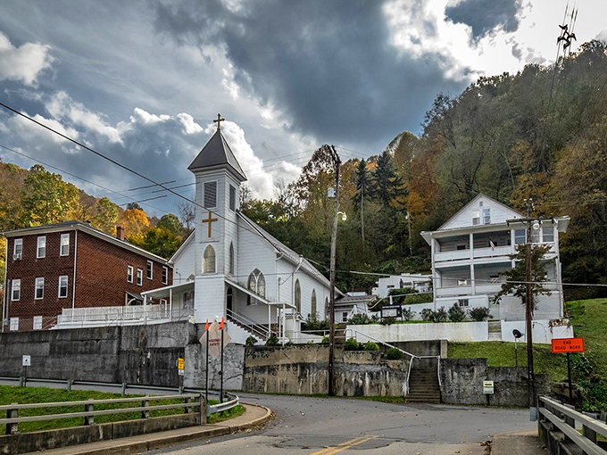 Holy Family Catholic Church stands bright against mountain shadows, its white clapboard simplicity a reflection of Richwood's unpretentious charm.