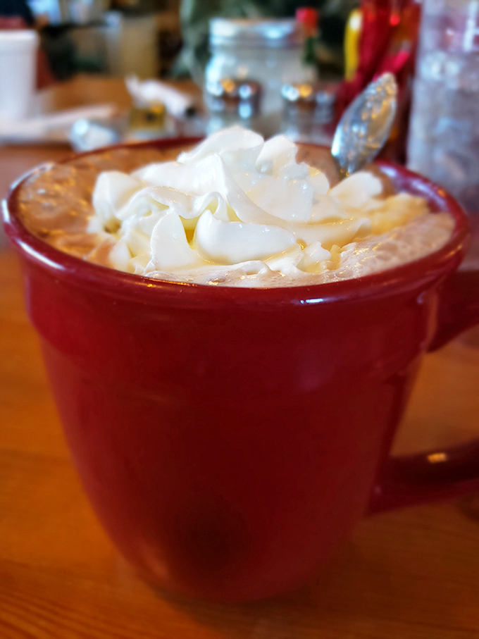 Hot chocolate that doesn't just warm your hands but hugs your soul, topped with a whipped cream cloud that deserves its own weather report.