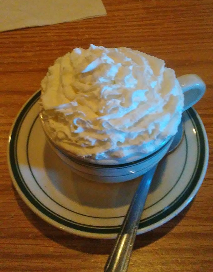Whipped cream mountain atop hot chocolate&mdash;proof that McWhorter knows comfort doesn't stop at savory. A sweet finale worth saving room for.