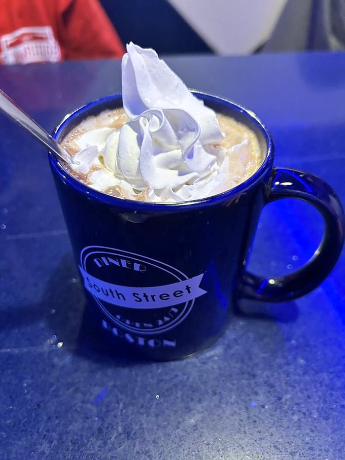 Hot chocolate that doesn't just warm your hands but your soul&mdash;topped with a cloud of whipped cream in the diner's signature blue mug.