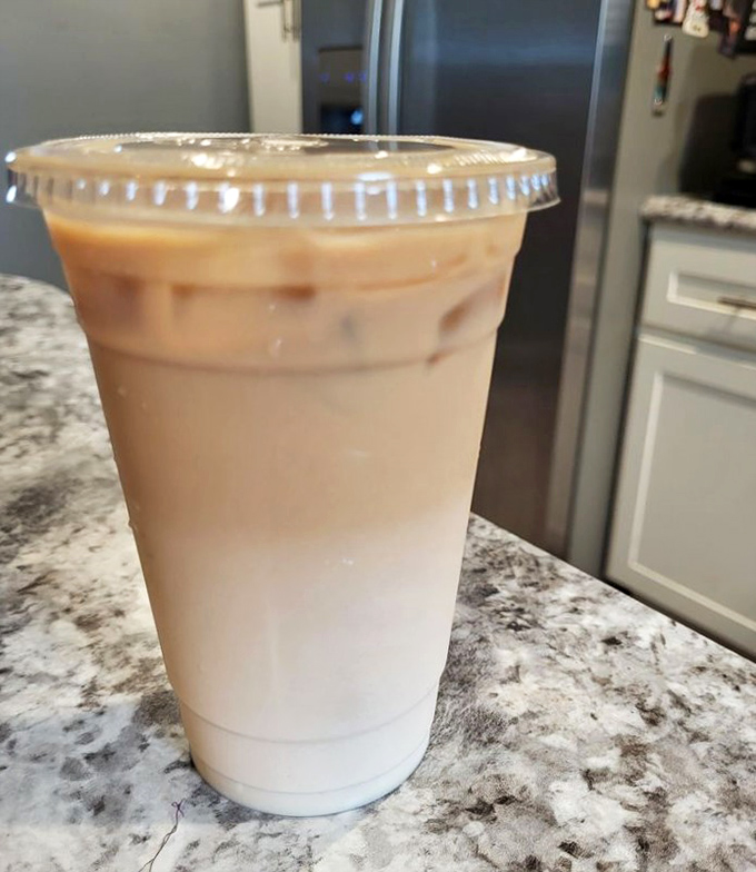 Coffee isn't just a beverage here&mdash;it's a proper morning ritual. This iced vanilla latte looks like the perfect balance of caffeine commitment and dessert-like indulgence.