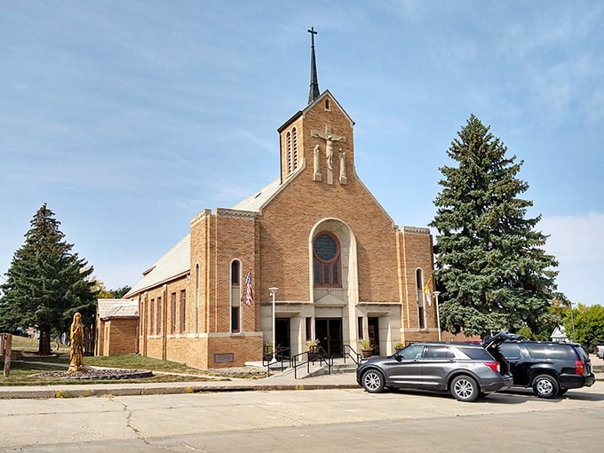 Immaculate Conception Catholic Church stands as a spiritual landmark in Winner, its brick facade and distinctive steeple visible from blocks away.