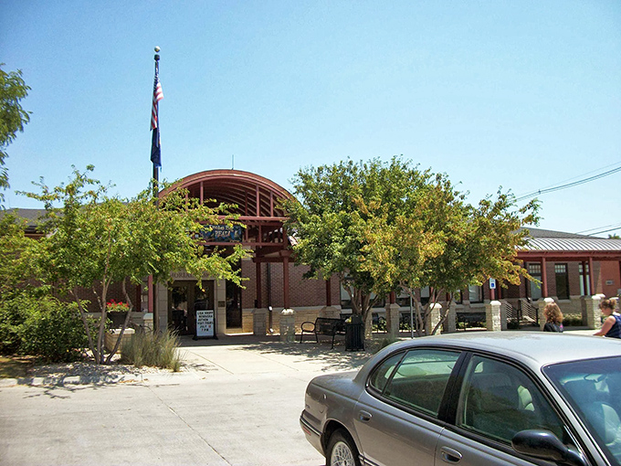 Seward's modern library welcomes visitors with shaded entryway and American flag, proving small towns can balance tradition with contemporary community needs.