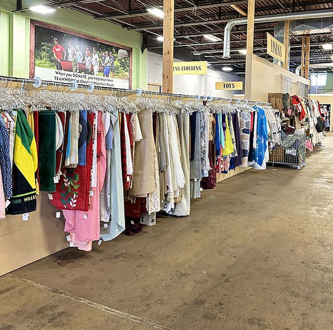 Formal dresses and blouses hang like colorful flags, a fashion United Nations of styles spanning decades.