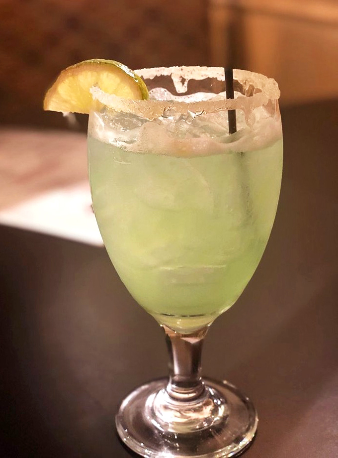 The margarita at Tucker's arrives like a cool breeze on a hot Carolina day – salt-rimmed, lime-garnished, and guaranteed to make waiting for your steak a pleasure.