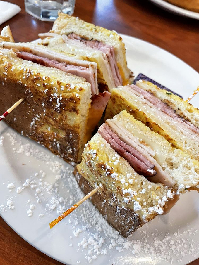 A Monte Cristo sandwich that's dressed better than most people at brunch. Powdered sugar on ham and cheese is the plot twist breakfast needed.