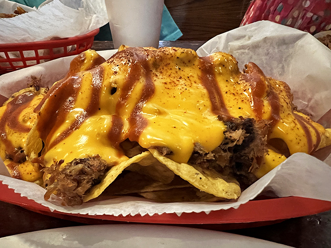 Behold: meat nachos that make ordinary nachos question their life choices. The cheese and sauce create a harmony that deserves its own Grammy.