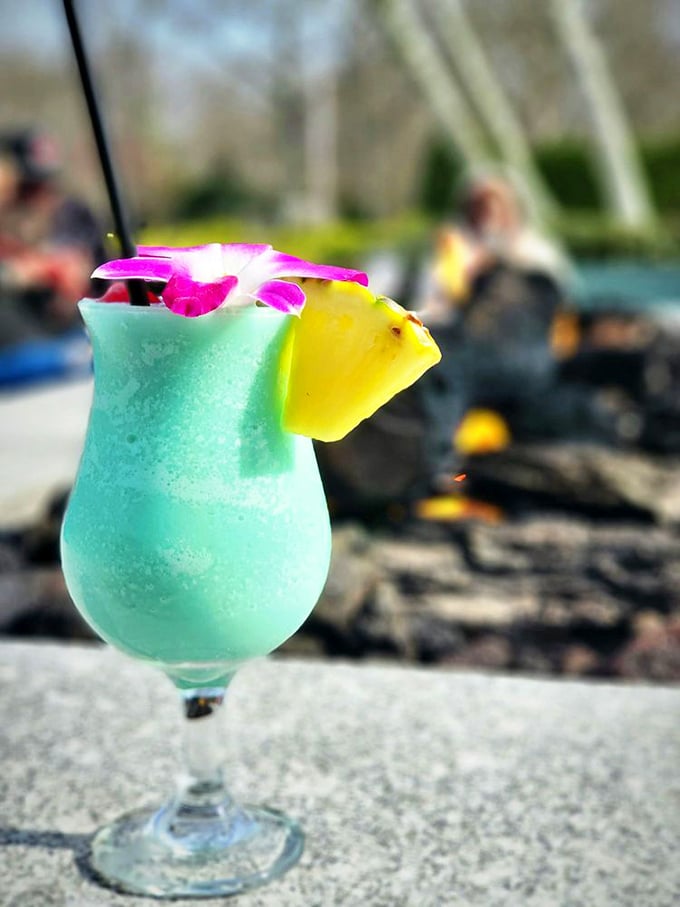 The blue tropical drink that says "I'm on vacation" even when you're just 20 minutes from home. That flower garnish isn't messing around.