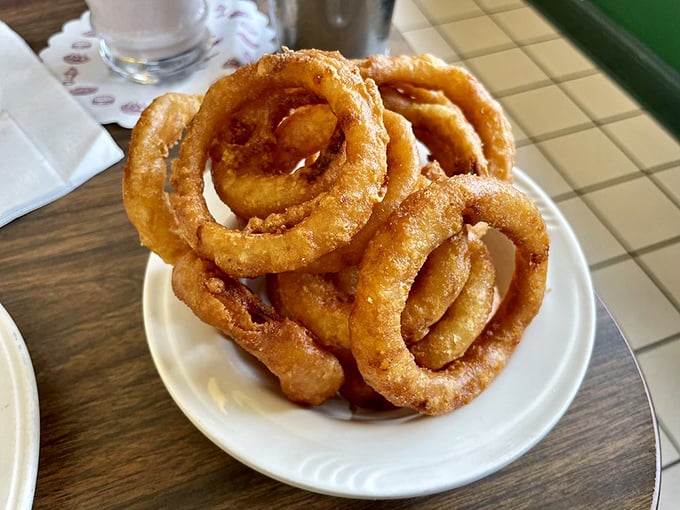 Onion rings stacked like delicious golden halos, proving that sometimes the simplest pleasures are the most divine.