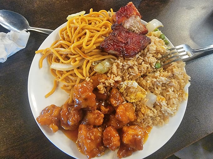 The holy trinity of buffet comfort: orange chicken, lo mein, and fried rice. Some food traditions become classics because they're simply irresistible.