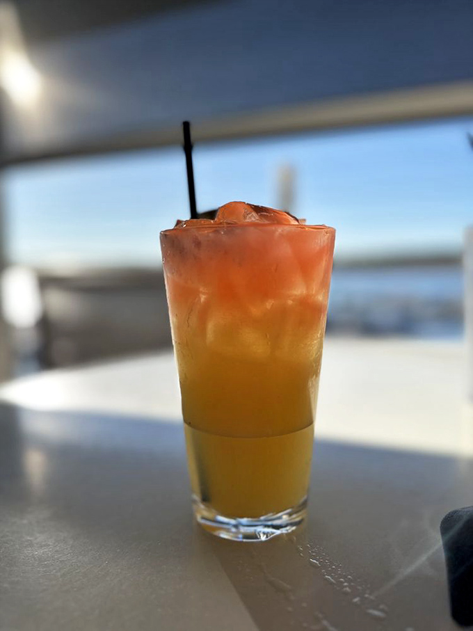 A sunset-colored cocktail with the reservoir view to match. Drinking this feels like cheating on your vacation budget&mdash;all the tropical vibes without the airfare.